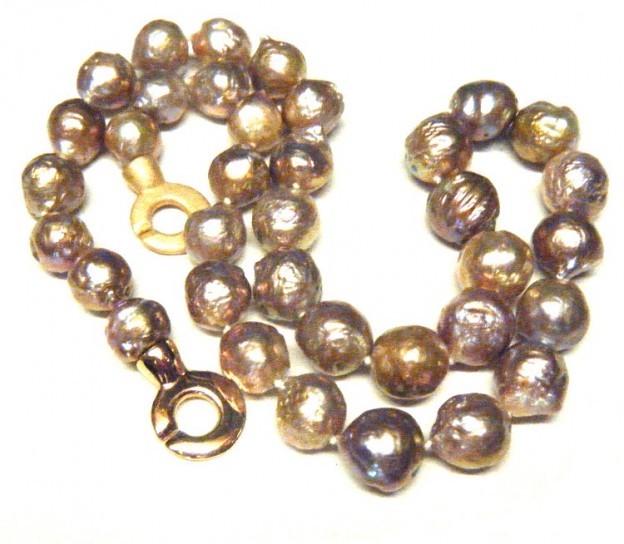 Nacre depth on bead nucleated freshwater pearls - Pearlescence